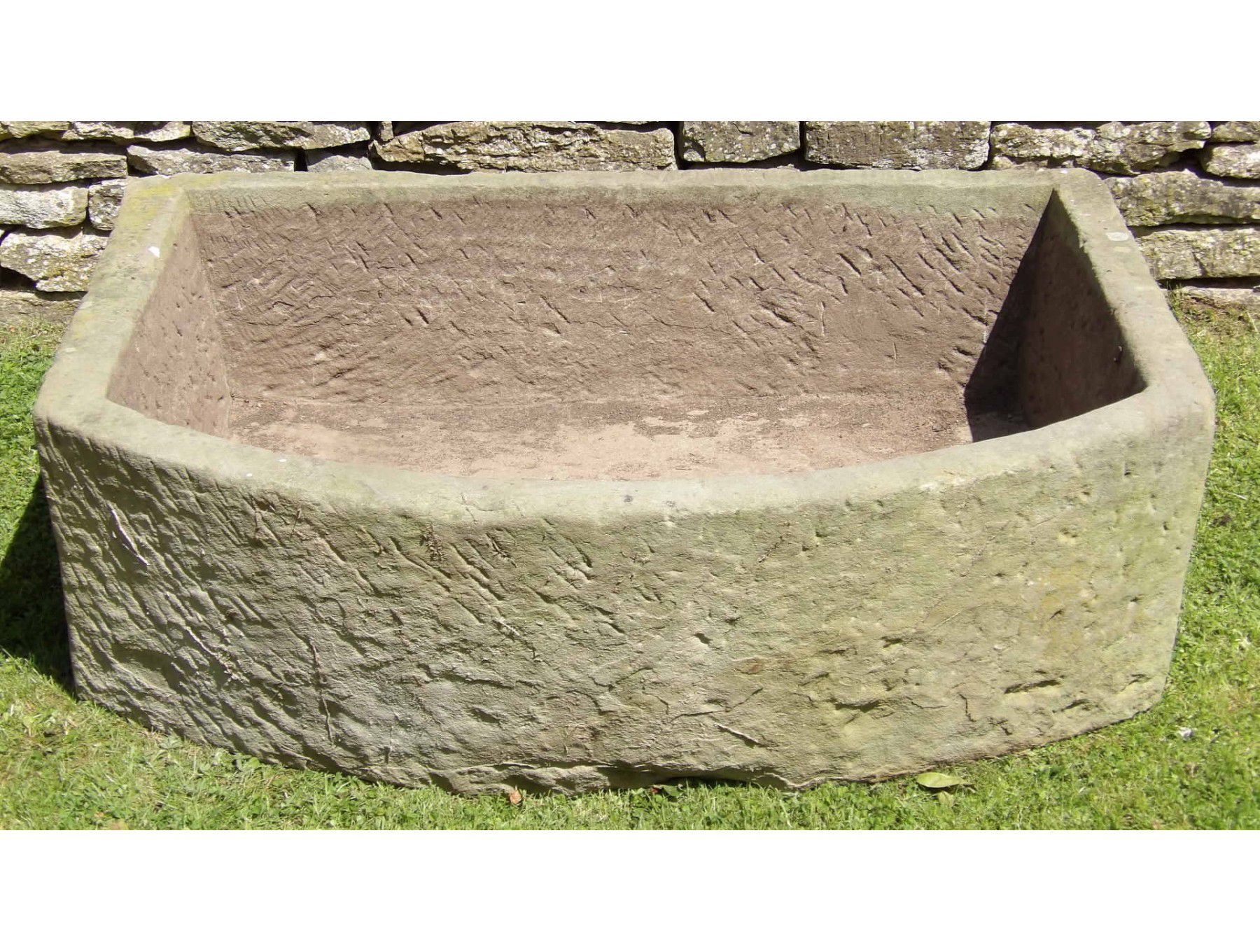 A Large Bow Fronted Stone Trough