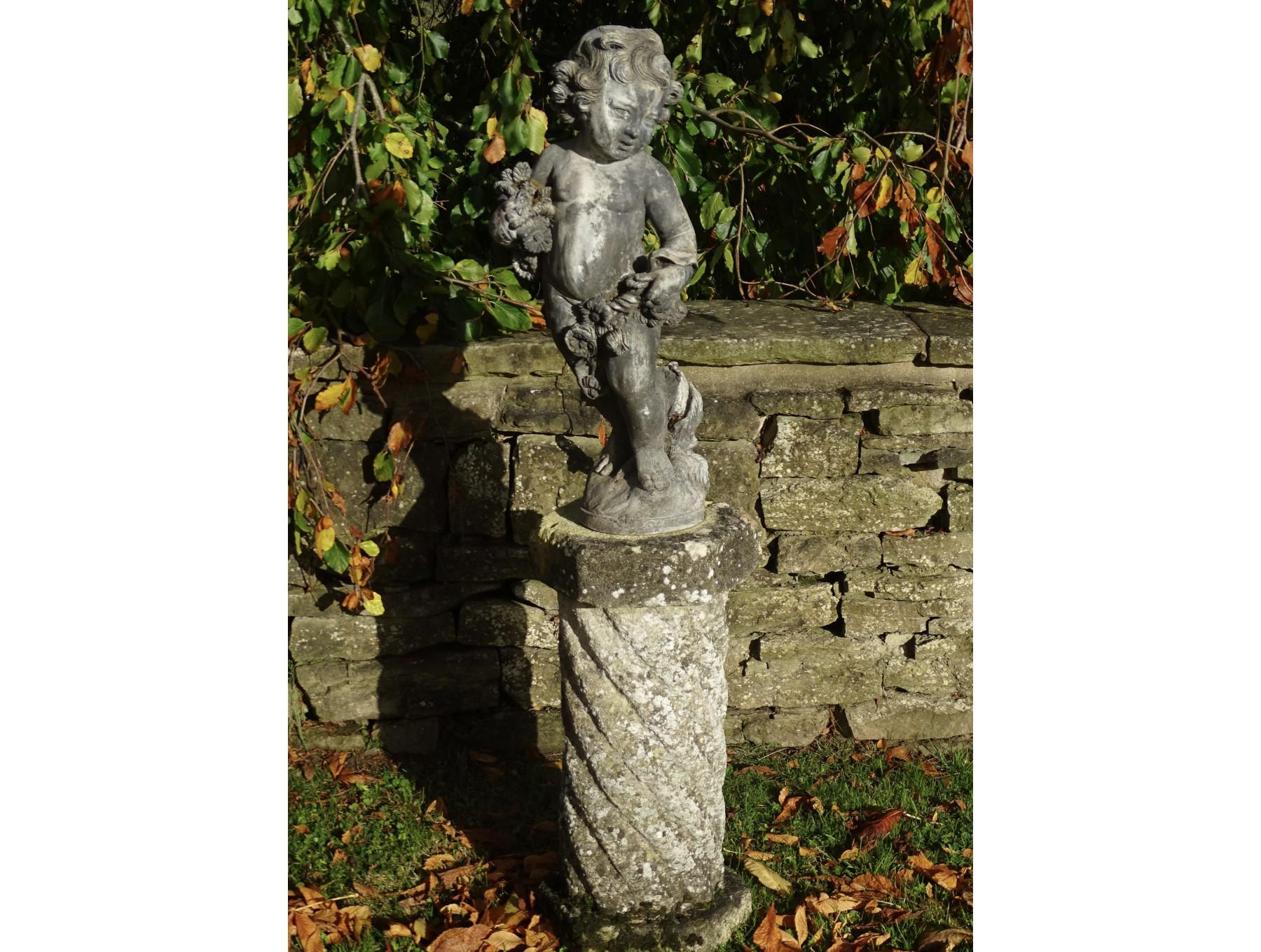 Antique garden statue | Lead putto figure | Holloways Garden Antiques